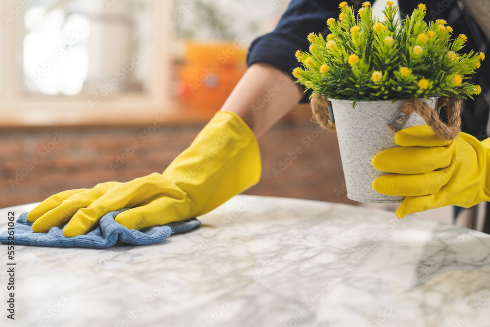 Cleaning hygiene, hand of maid, waitress woman wearing yellow ...
