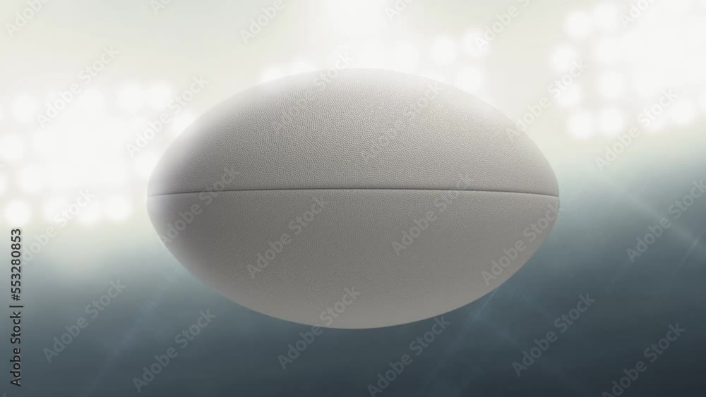 A seamlessly loop able animation of a white textured rugby ball ...