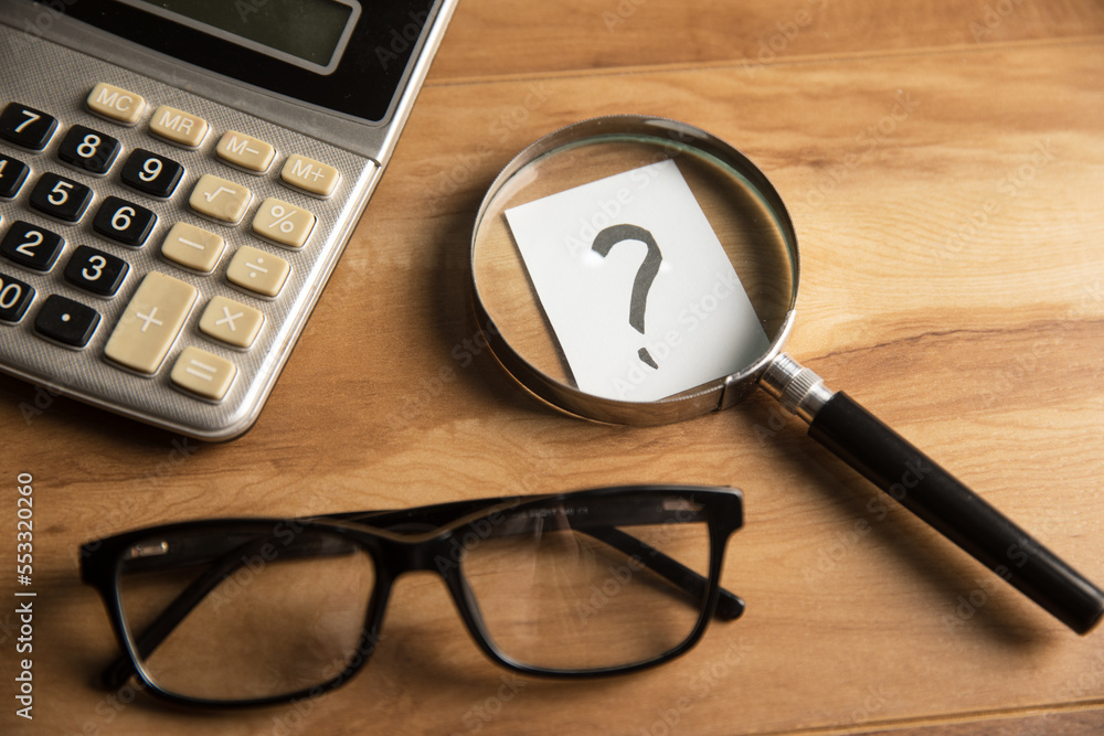 Question mark, calculator and magnifier Stock Photo | Adobe Stock
