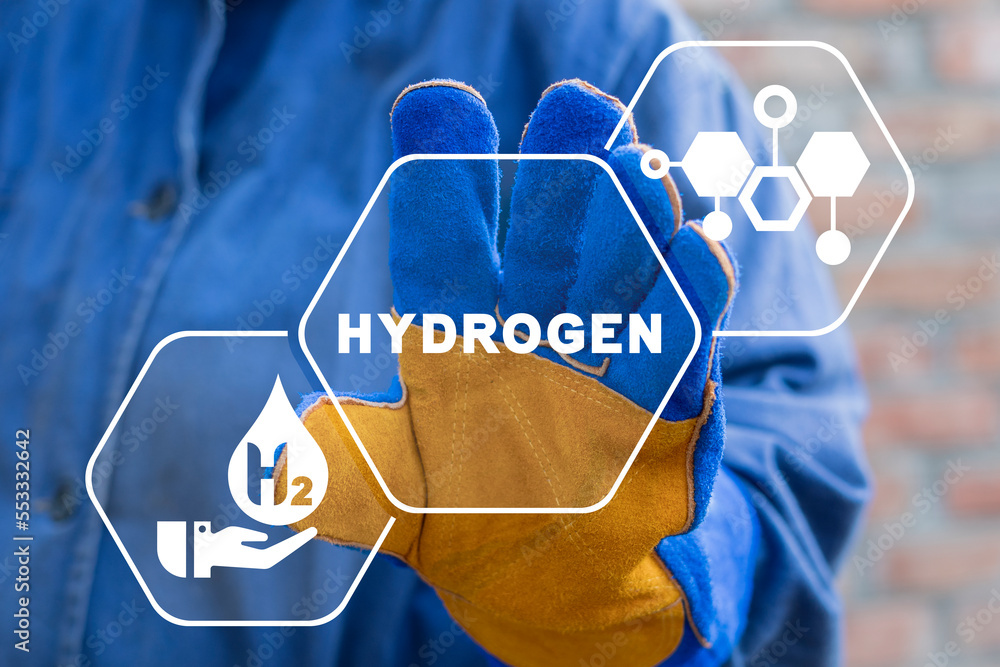 Engineer using virtual touchscreen presses word: HYDROGEN. Concept of hydrogen production. H2 ...