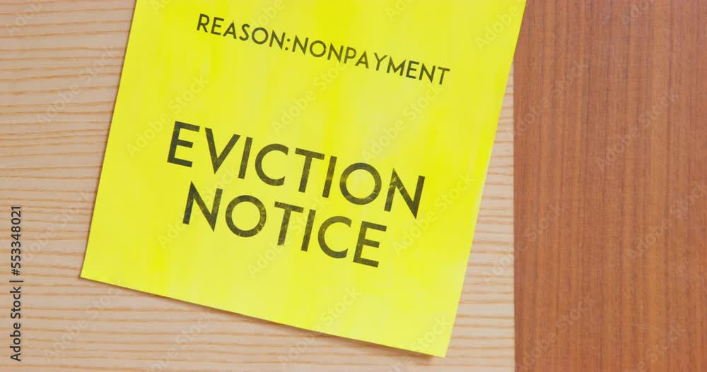 Yellow warning Eviction Notice of nonpayment utility bills hangs on ...