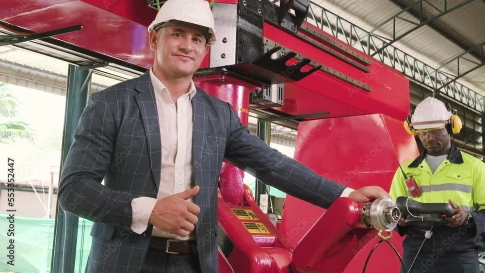 White male entrepreneur is proud successful with robotic arm, thumbs up ...