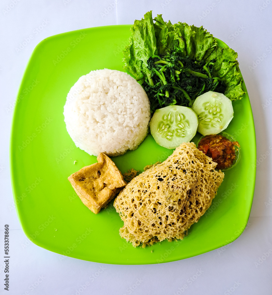 Ayam Goreng Kremes. Popular fried chicken dish from Jogjakarta, deep-fried whole chicken and ...