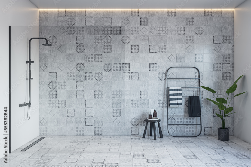 Front view on modern shower behind glass partition in stylish bathroom ...