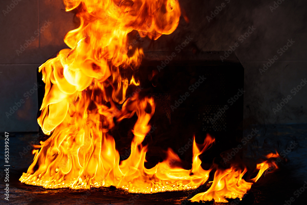 fire and molten plastic on a black background. the concept of fire in ...