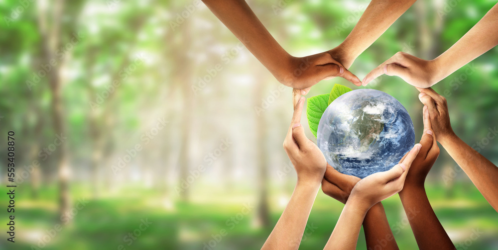 Conceptual symbol of multiracial human hands surrounding the Earth ...