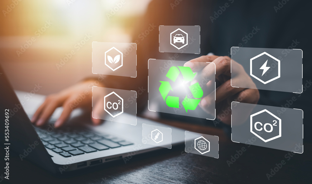 Businessman using laptops and touch recycle symbol with virtual modern ...