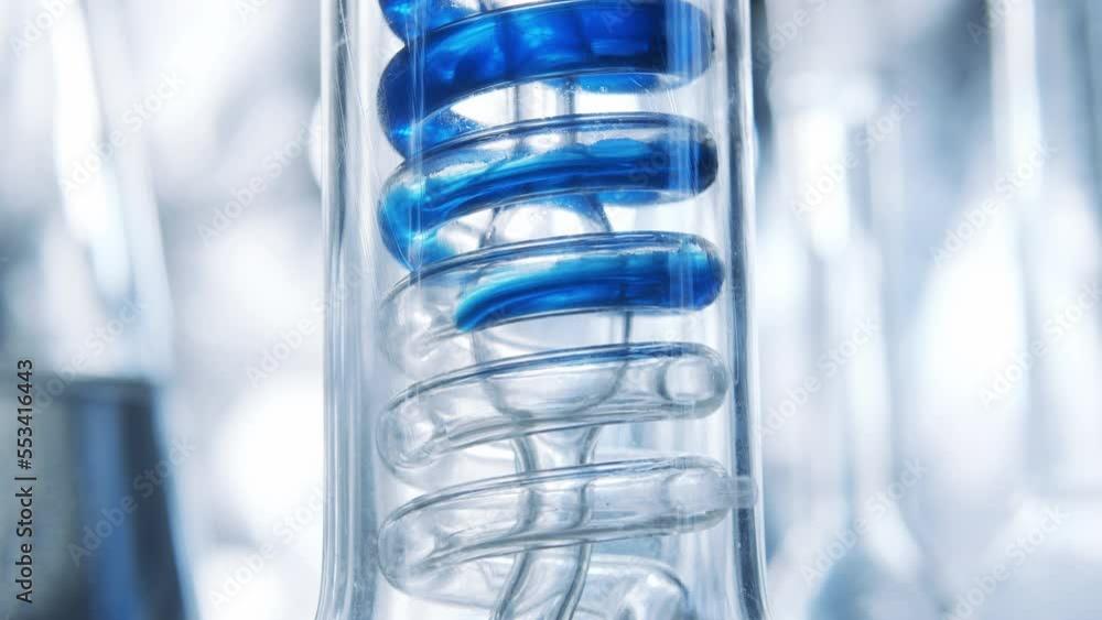 Vídeo do Stock: Blue fluidity flows through spiral pipe. Glass big test ...