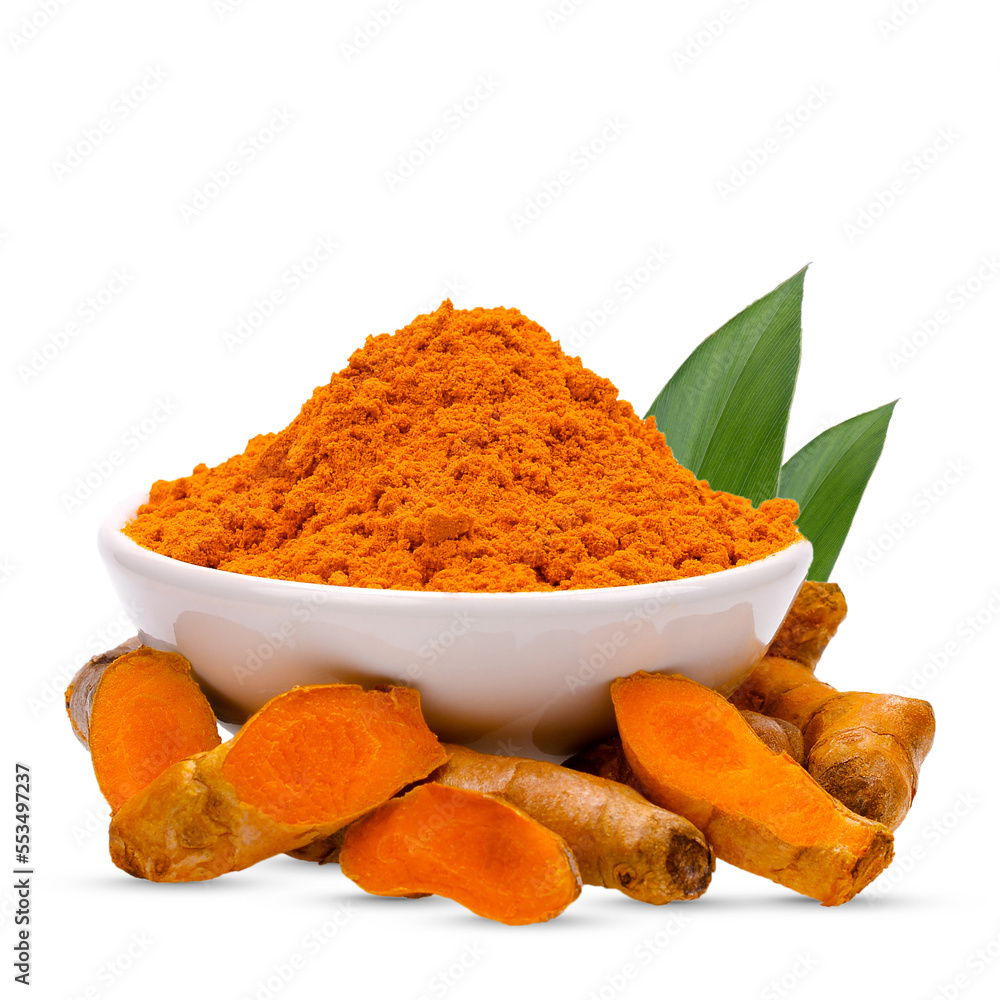 Dry turmeric powder in white bowl with turmeric root , sliced and ...