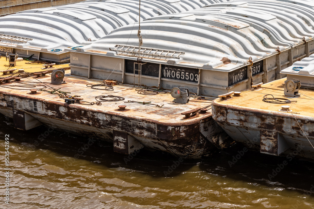 Rigging gear and wire rope on the deck of a barge along the Mississippi ...