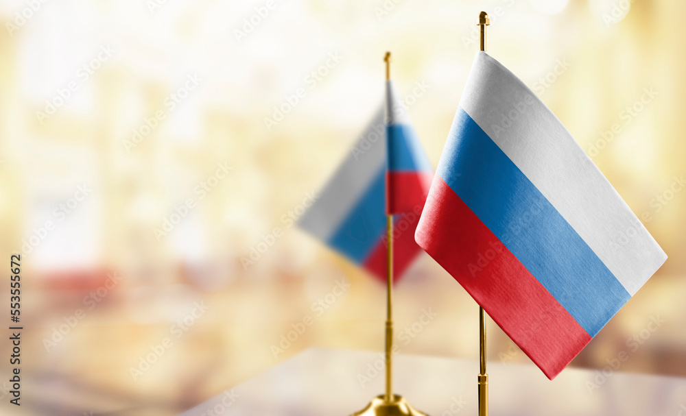 Small flags of the Russia on an abstract blurry background Stock Photo ...