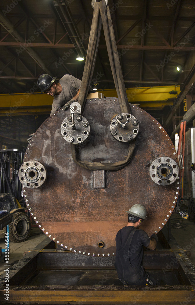 Bolting up the face plate of a line heater for pneumatic test, with the ...