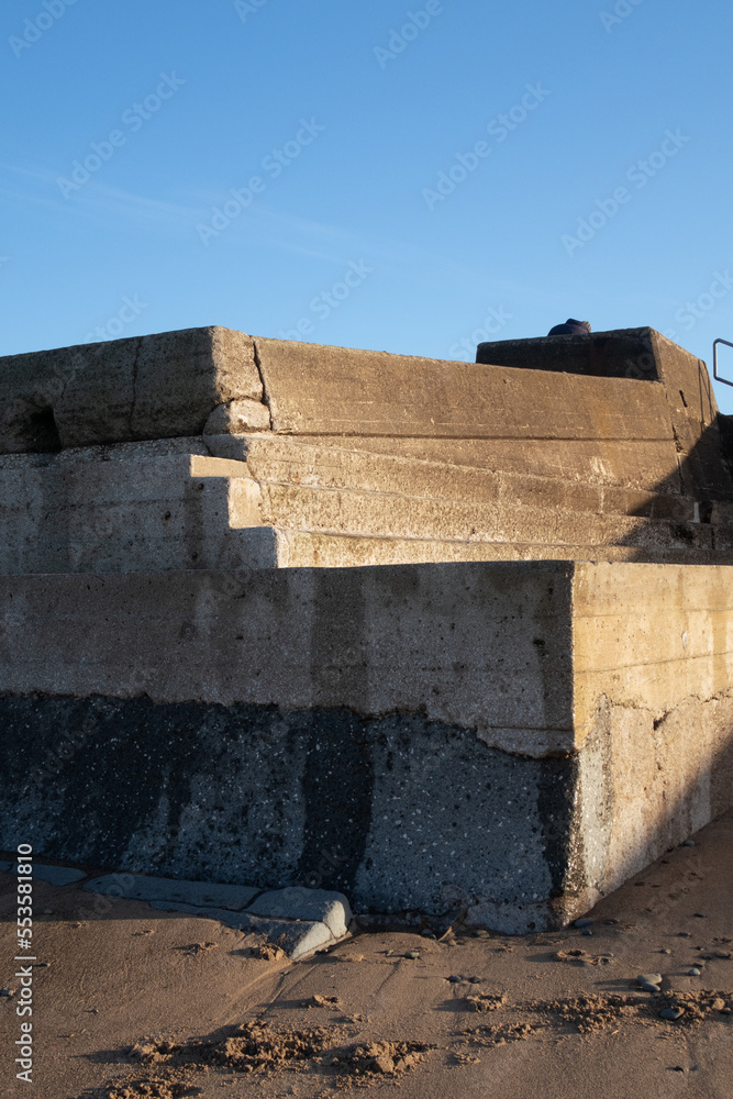 Old decaying cement seafront flood defence wall system. Sea defence sea ...