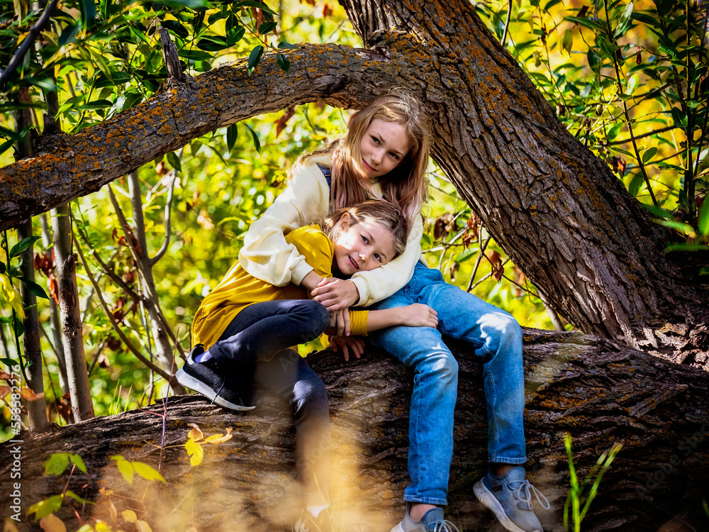 Two sisters posing for a picture while enjoying each other's company ...