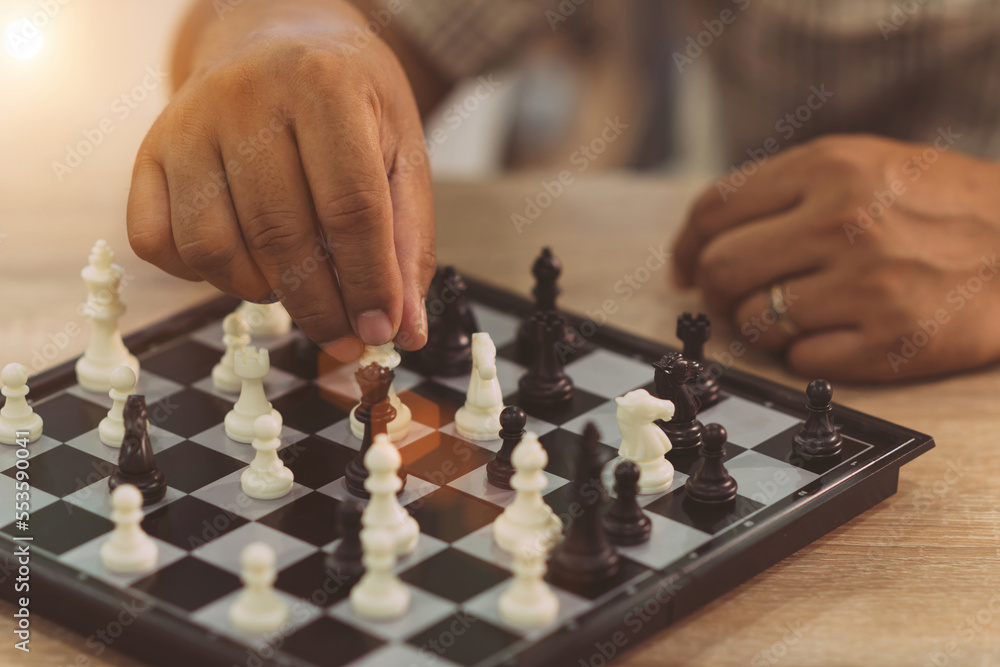 business person play chess game. office people have a break by test ...