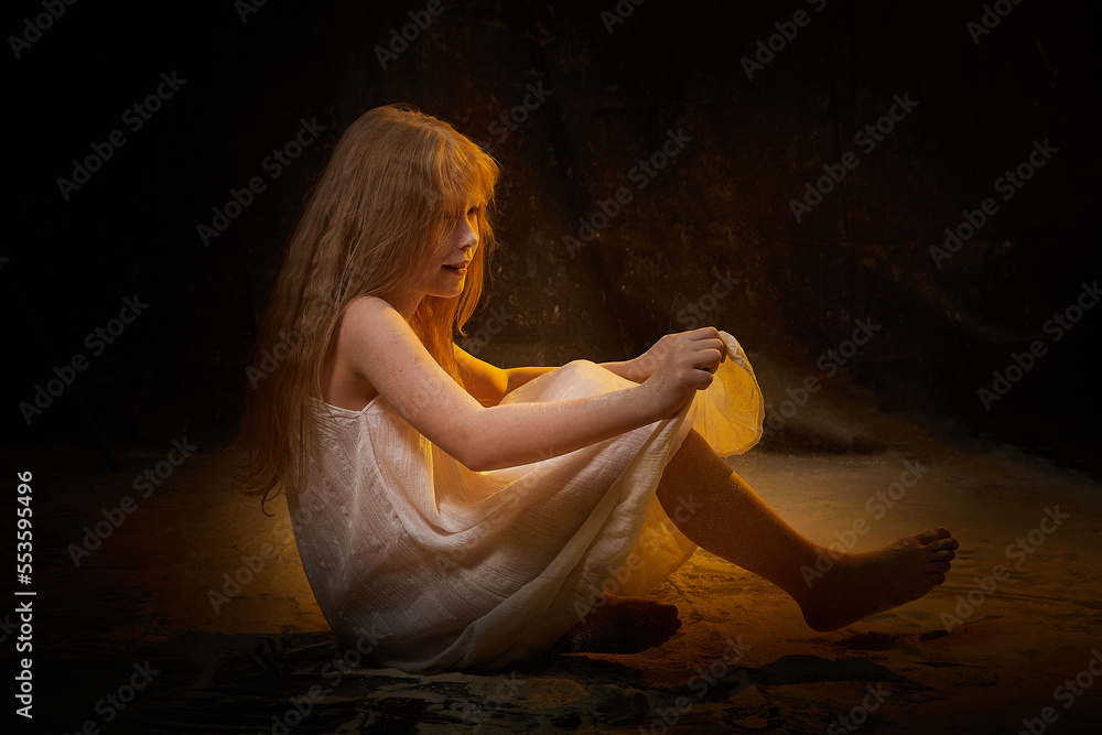 A girl in a white shirt and with long hair, looking like a ghost. A ...