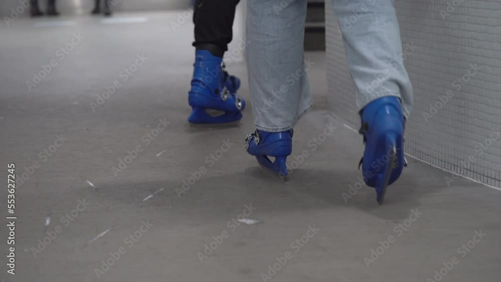 Clumsy People Walking On Hard Floor To Reach Ice Rink On Skating Shoes ...