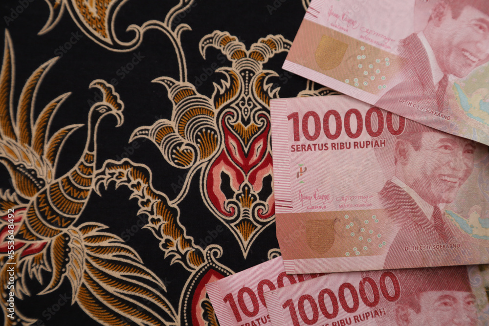 rupiah banknotes in the 100,000 denomination on the background of ...