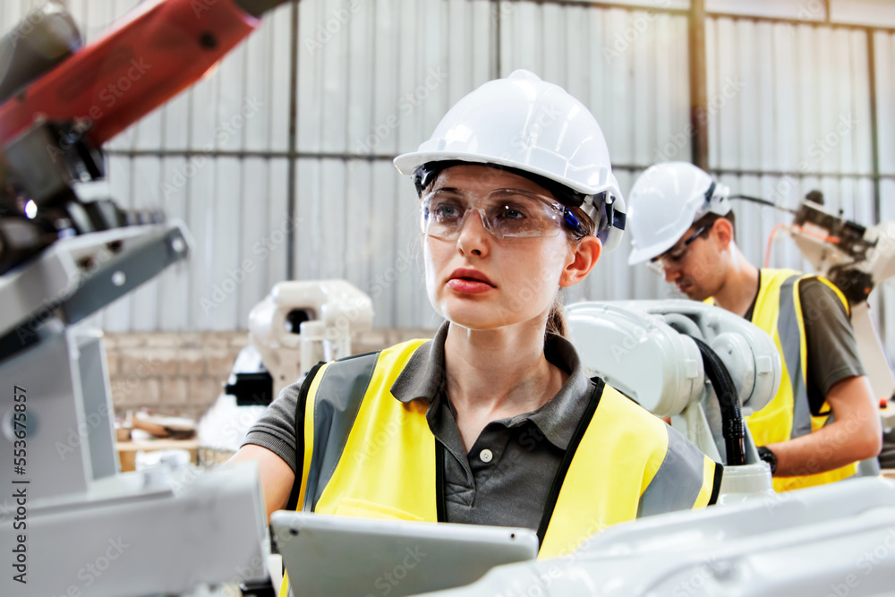 Foto de Female electrician engineer working together with male engineer ...