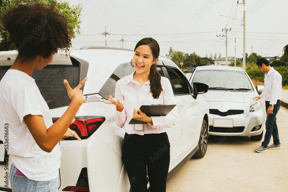 Car insurance company representative listens to information with smile ...