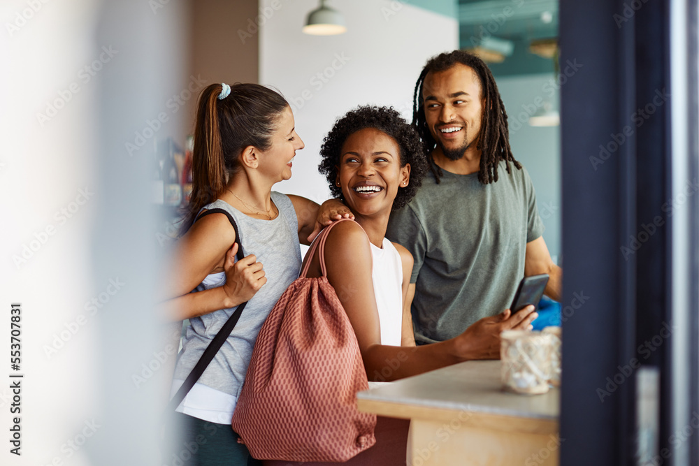Laughing friends hanging out in a cafe after the gym Stock Photo ...