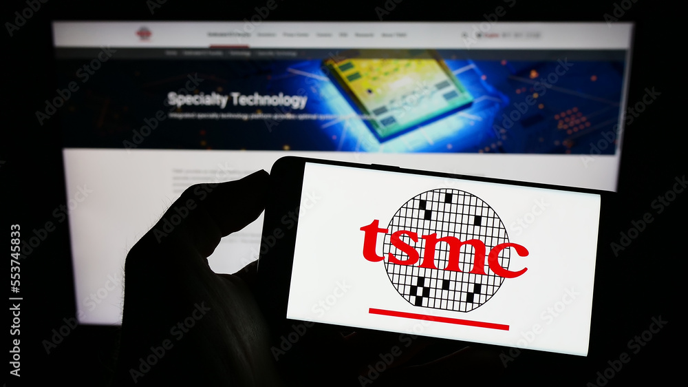 Stuttgart, Germany - 11-30-2022: Person holding cellphone with logo of Taiwan Semiconductor ...