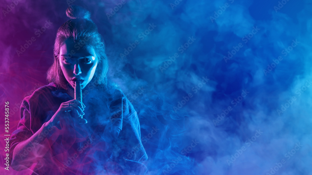 Vape woman. Vaper in clouds of smoke. Girl with vaping device in hands ...
