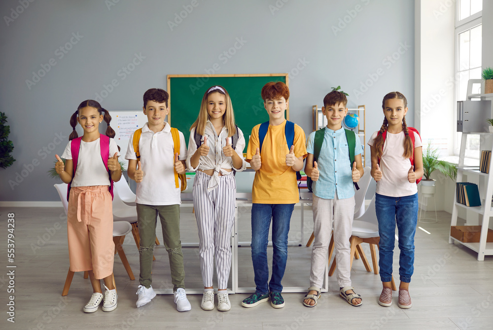 Children back to school. Happy group of schoolchildren ready for school ...
