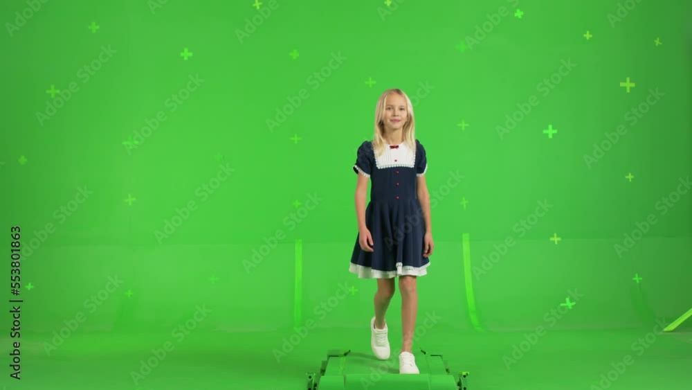 Young beautiful girl in dress walks on Green Screen, Chroma Key. Stock ...