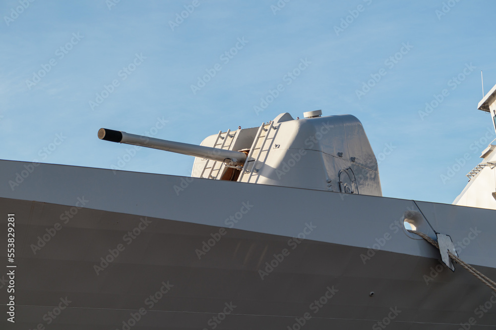 An artillery gun on board a warship. A naval gun turret on a battleship ...