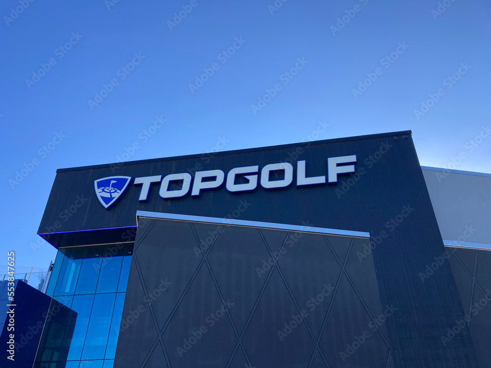 Topgolf sign, logo on the building facade of sport entertainment venue ...