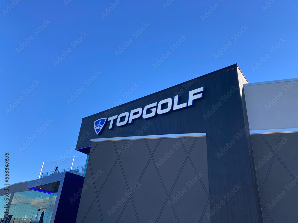 Topgolf sign, logo on the building facade of sport entertainment venue ...