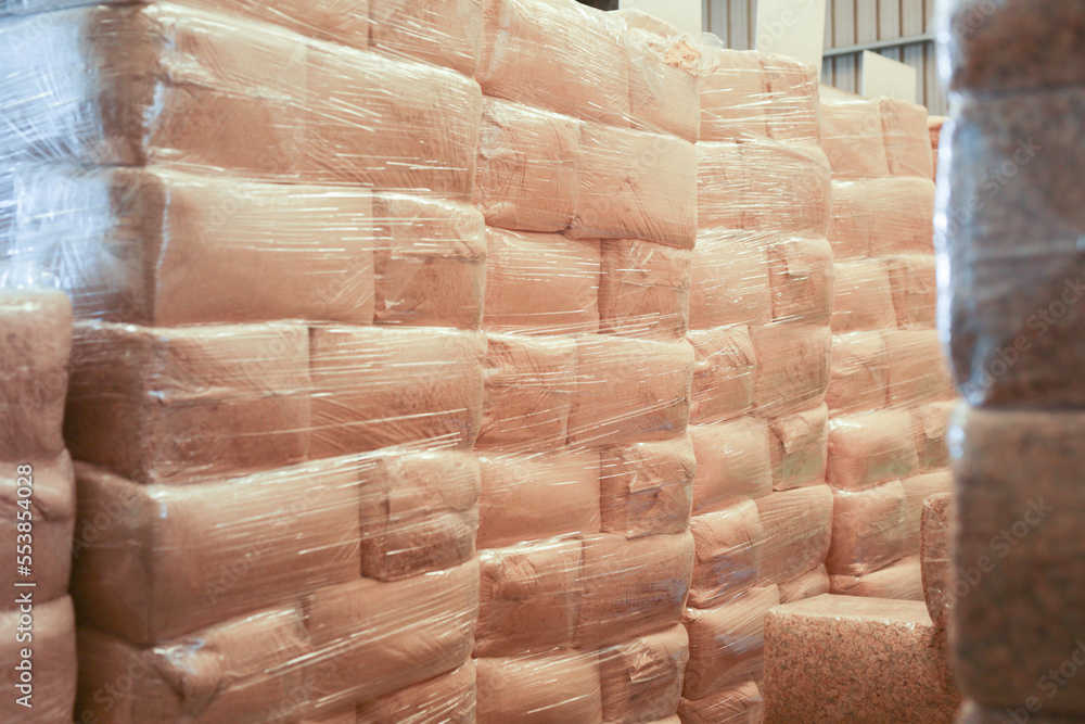 Lots of bags stacked in warehouse. Packaged goods in storehouse. Stock ...