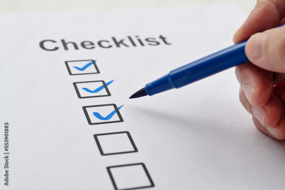 Blue pen marking on checklist sheet Stock Photo | Adobe Stock