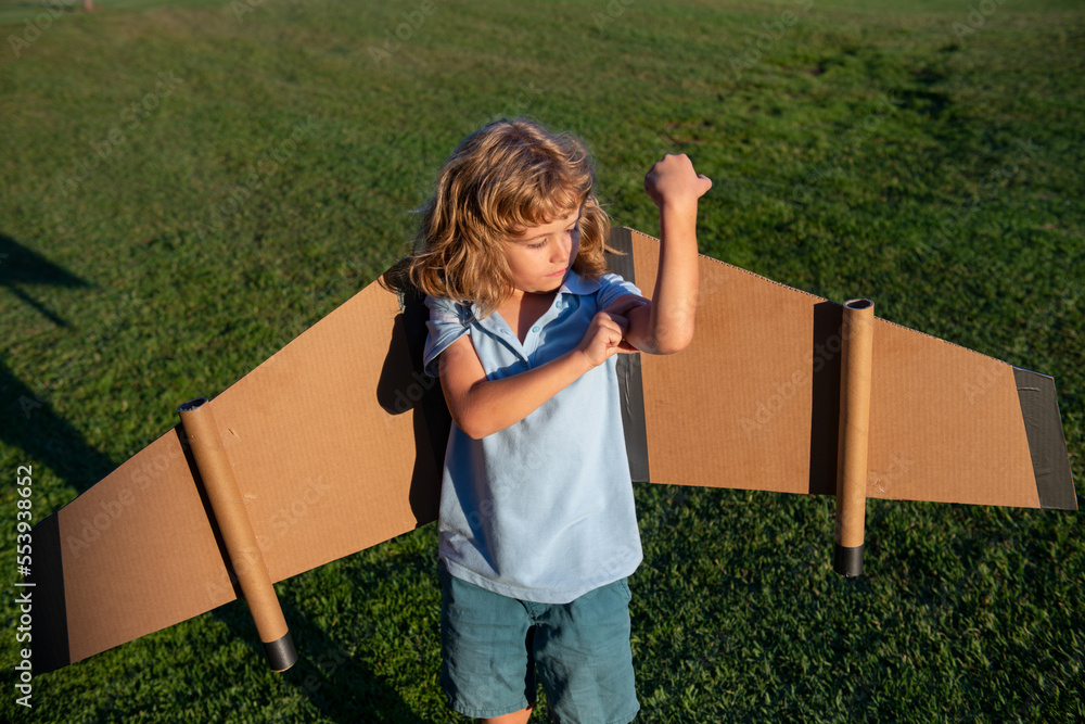 Strong kid. Superhero child shows muscles. Success, motivation concept ...
