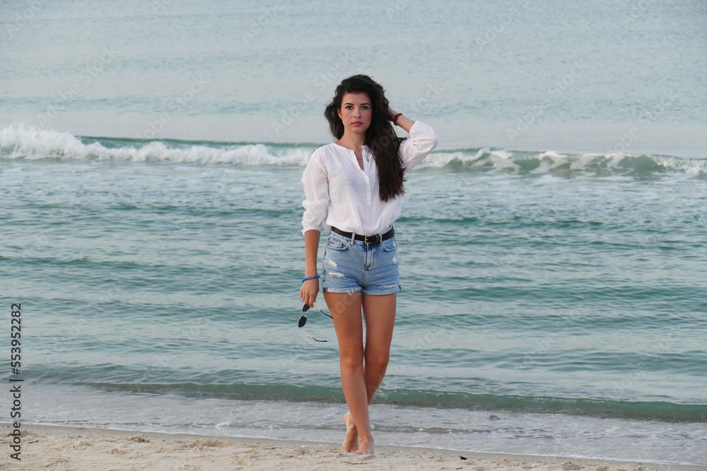 Slim girl walking by the sea. Summer lifestyle image of happy woman ...