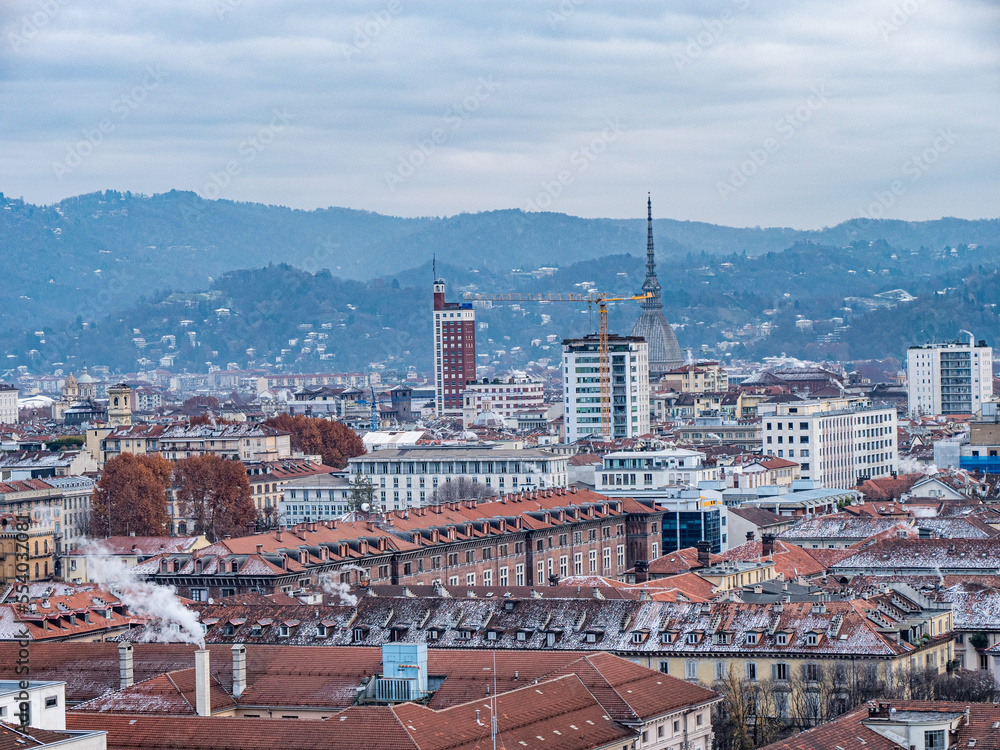 Skyline of Turin, Italy, in winter. The mountain in back and the Mole ...