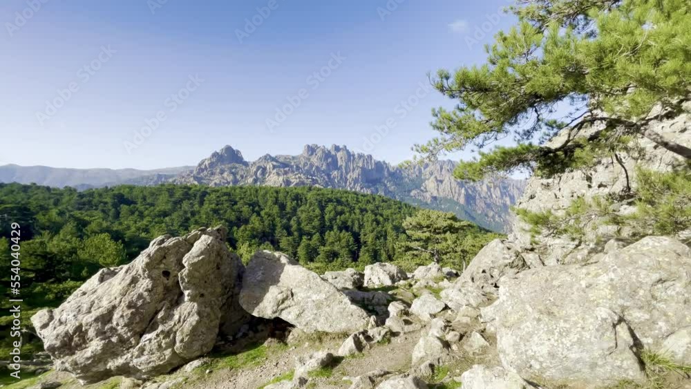Walking to very rocky Corsican mountain range of the Aiguilles de ...