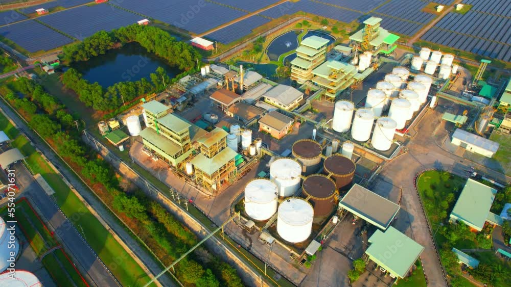 Drone flying above a large oil storage tanks on the ground. crude, ULG ...