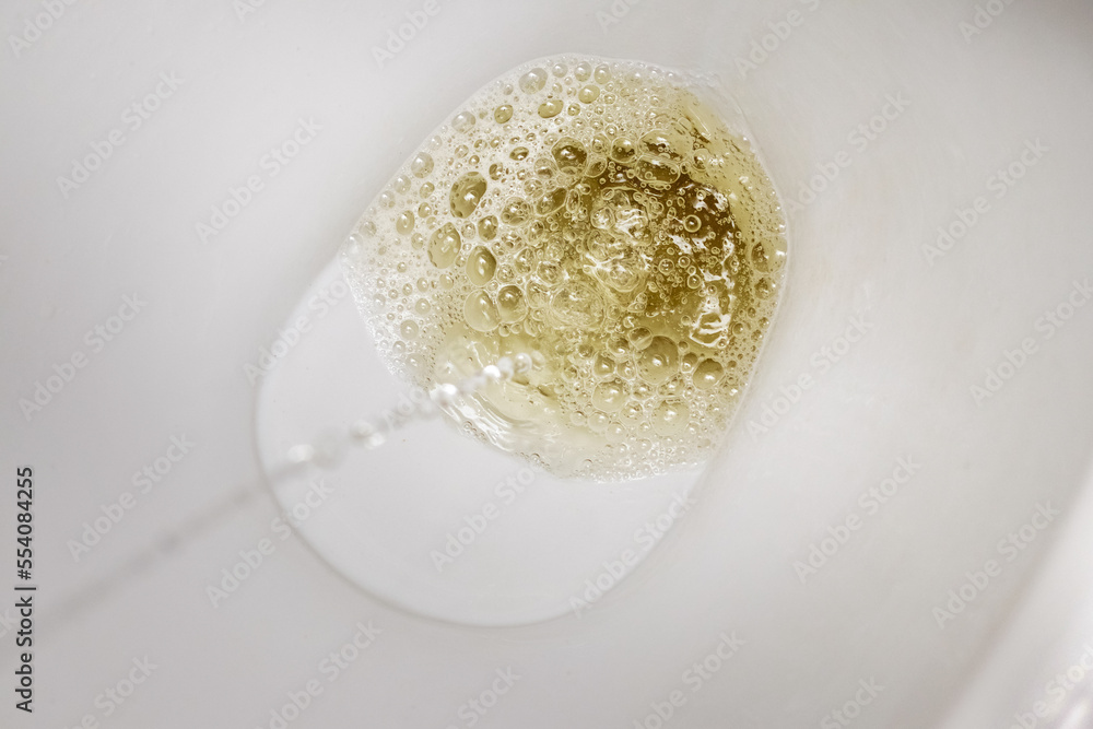 The lavatory in the toilet and the stream of urine during urination ...