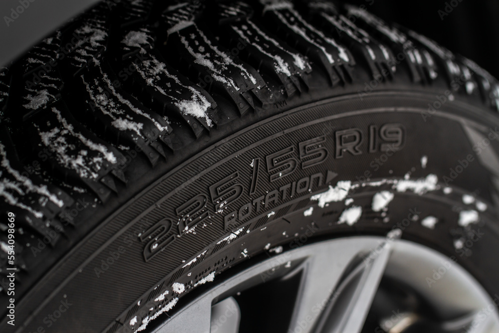 Close up view of tire with tire width, height and wheel diameter ...