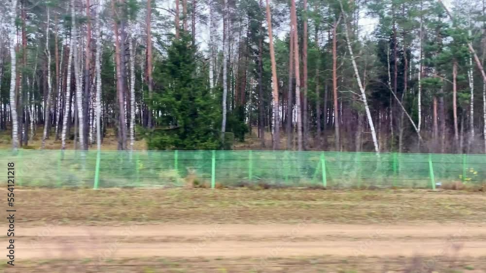 Train passenger point of view travel through countryside Lithuania on ...