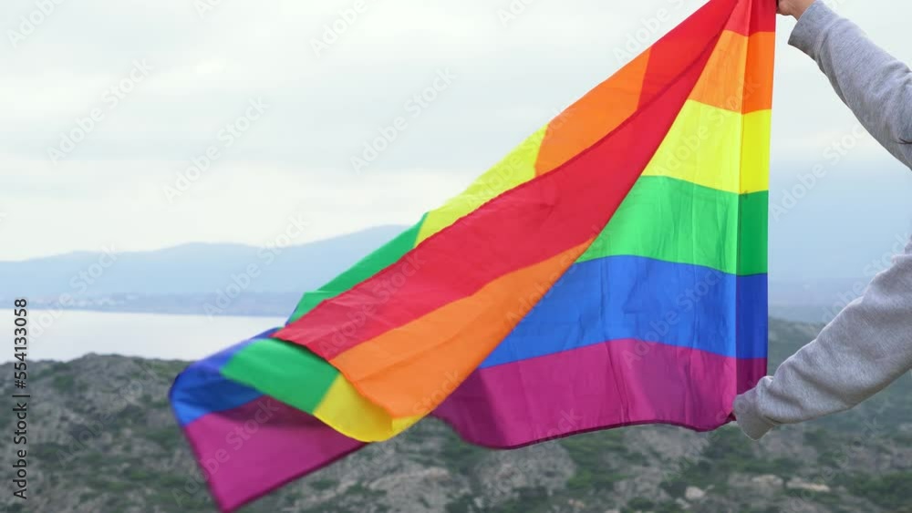 Video Stock A LGTB flag being waved outdoors. Person waving a LGBT flag ...