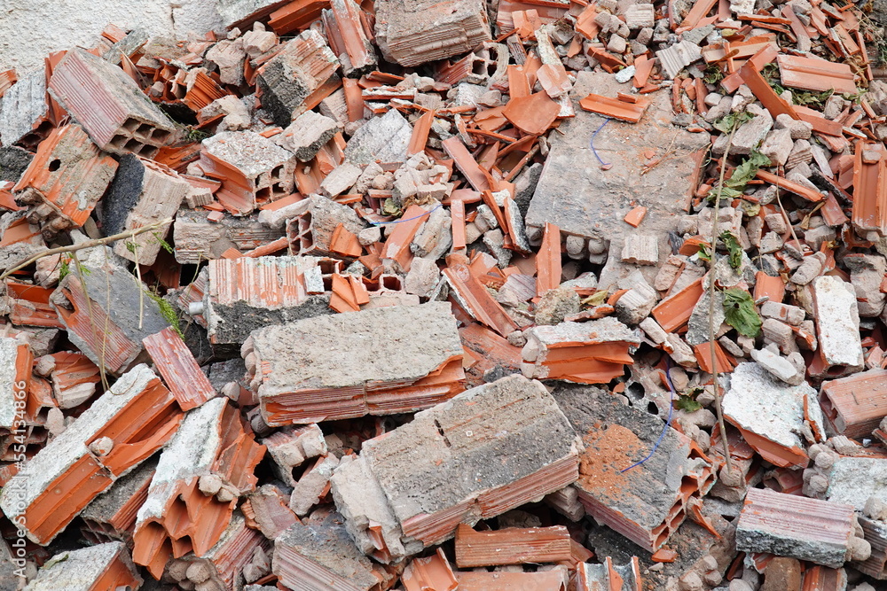 Broken parts of the wall. A destroyed house. Broken Brazilian bricks ...