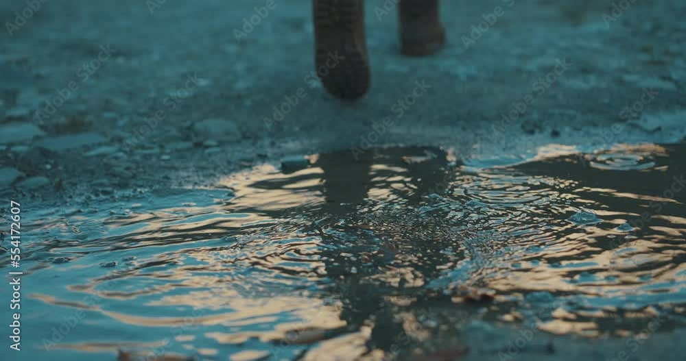 Foot stepping into a puddle in slow motion ready for drading 4K Stock ...