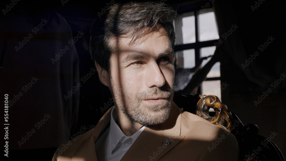 A handsome man with the sun on his face. Action.A bright illuminated ...