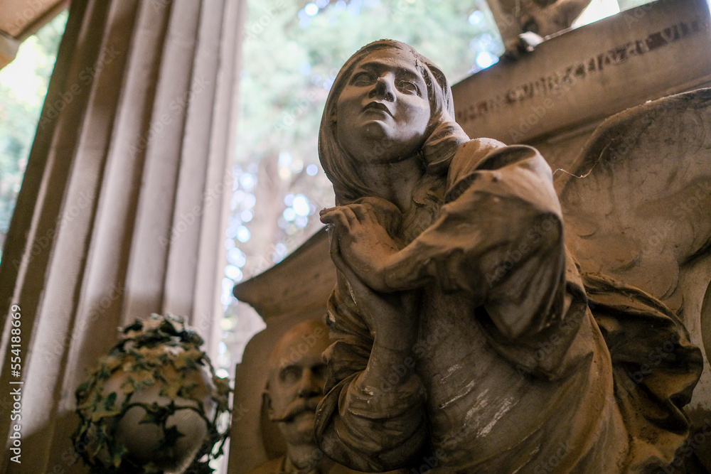 statue of sad woman in abandoned cemetery Stock Photo | Adobe Stock