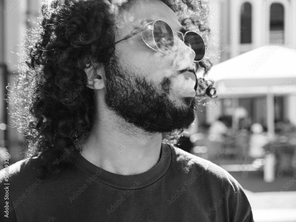 Closeup portrait of handsome smiling hipster model.Unshaven Arabian man ...