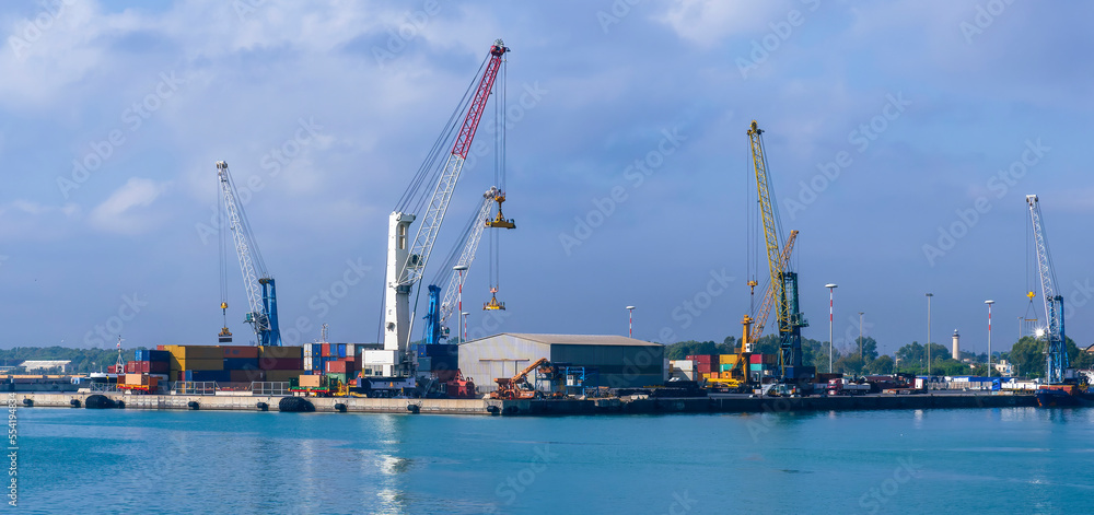 cargo sea port with cranes, container stacks and trucks with goods, sea ...