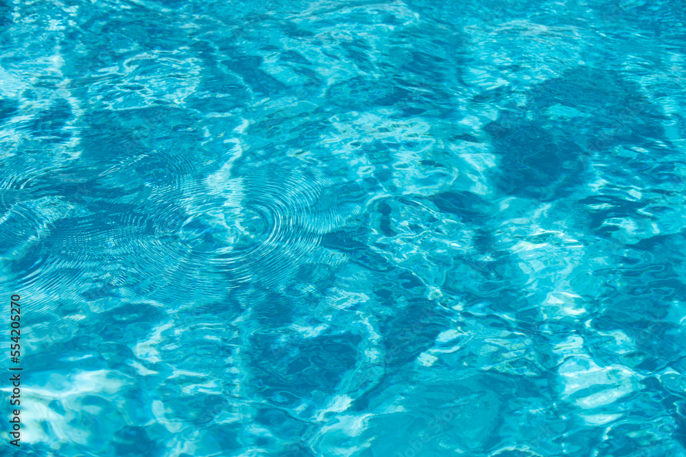Ripped water in swimming pool. Surface of blue swimming pool ...
